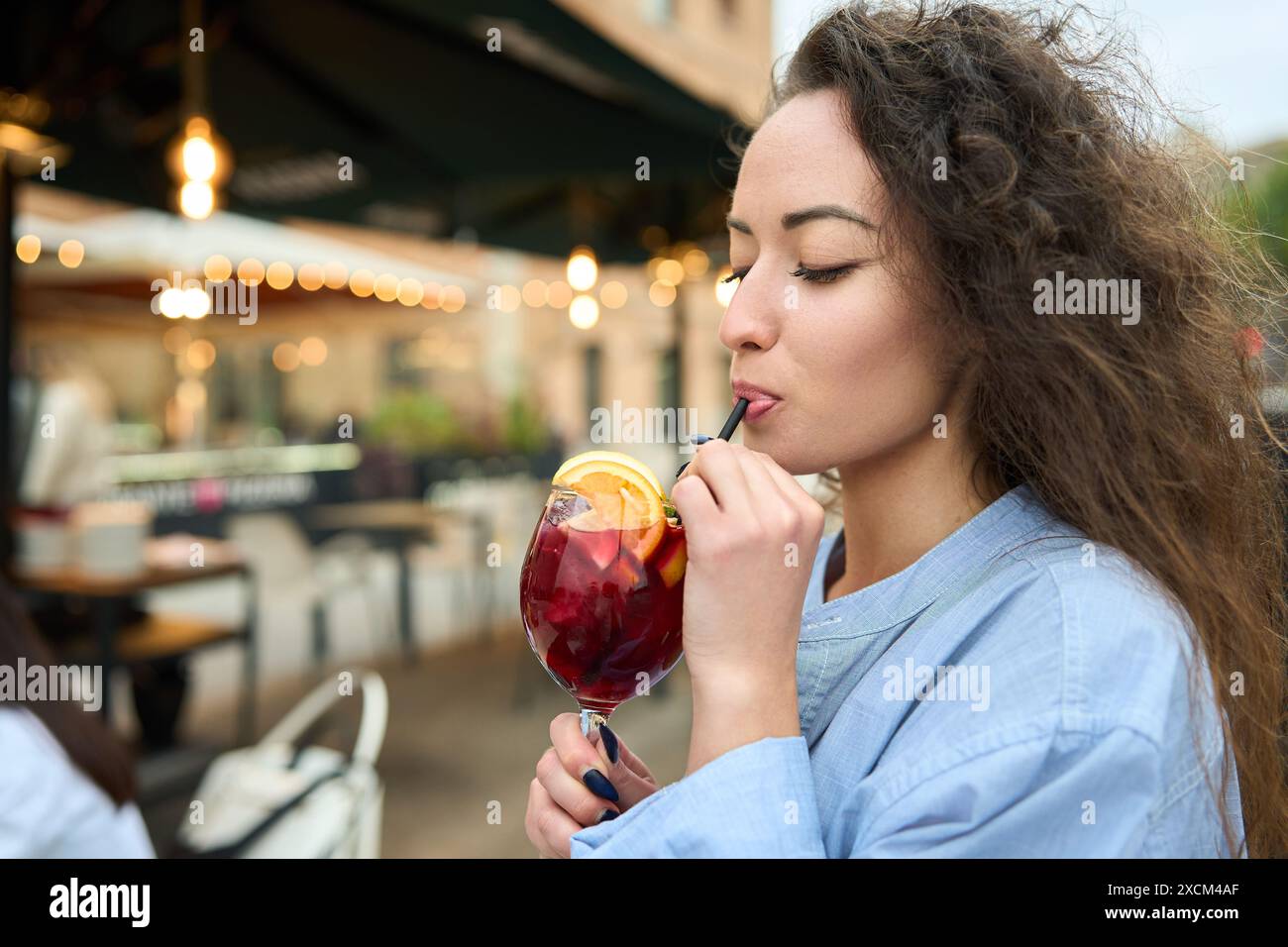 Pretty female drinking fresh cocktail hi-res stock photography and ...