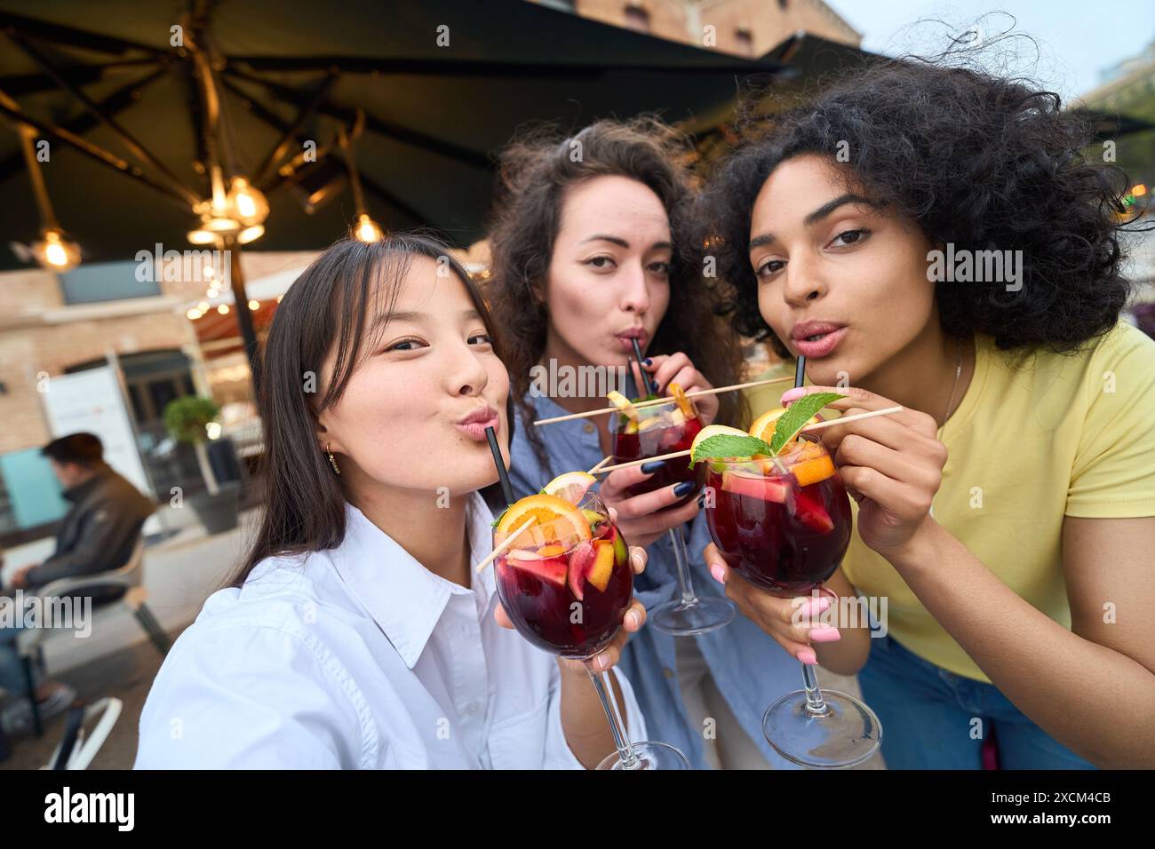Sipping drink through straw hi-res stock photography and images - Alamy