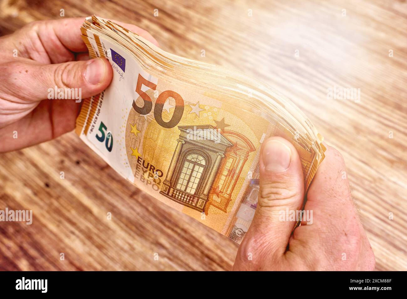 Germany - June 17, 2024: Banknotes in the hand. 50 euro banknotes as a ...