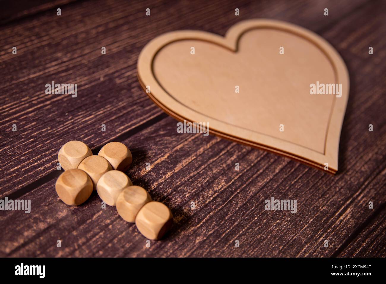 Wooden background with olive heart and white cross for an obituary ... Wooden background with olive heart and white cross for an obituary ...