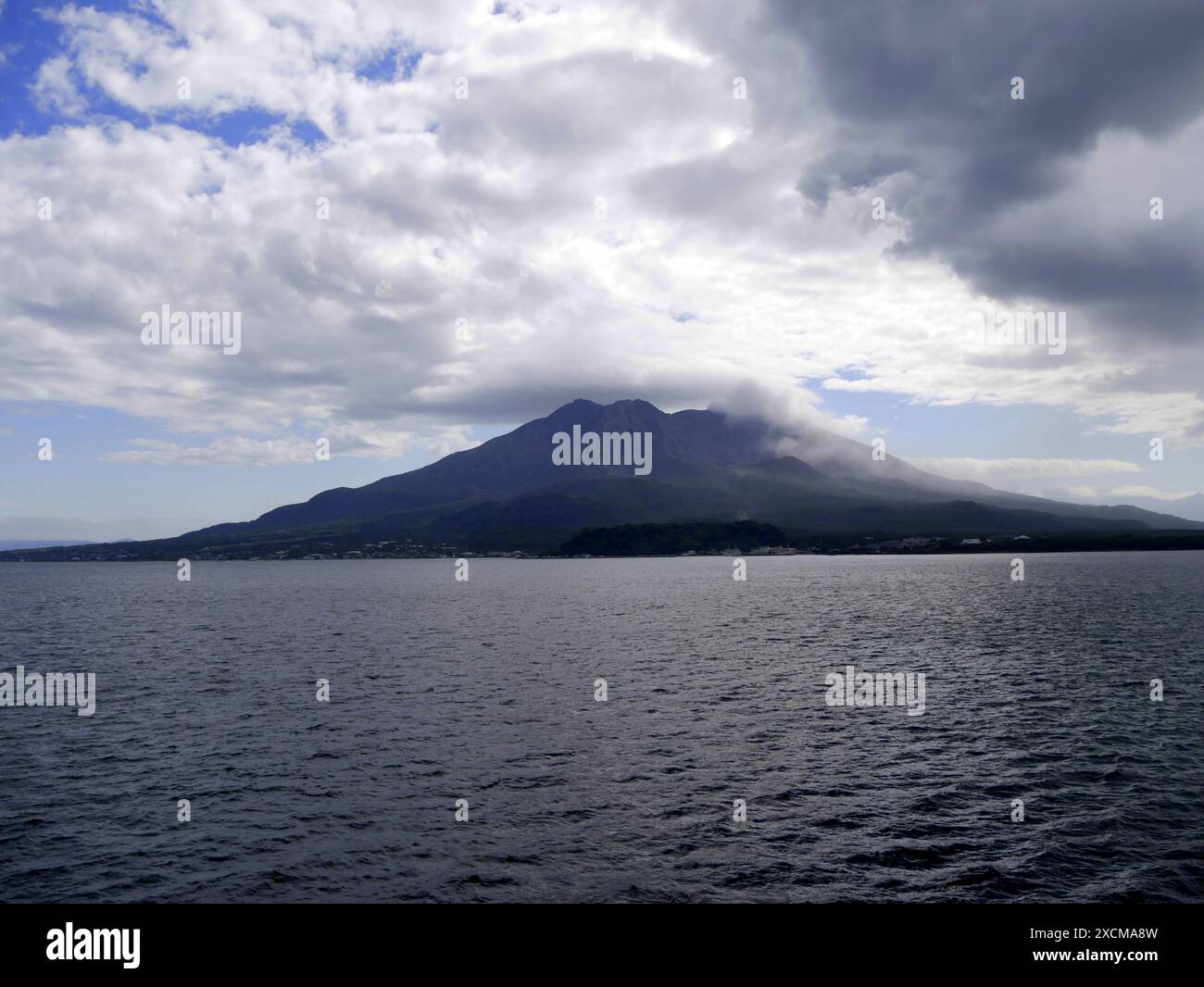 Sakurajima volcanic island seen fron Kagoshima, Kyushu, japan. Fuming ...