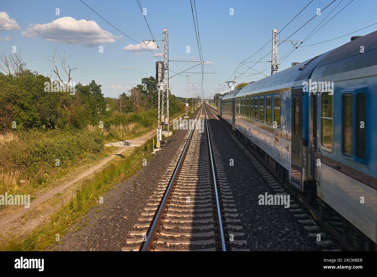 Rails with train, railway travel Stock Photo - Alamy