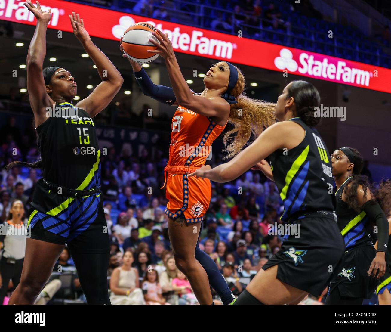 June 15, 2024: Connecticut's .DiJonai Carrington (21) drives the lane ...