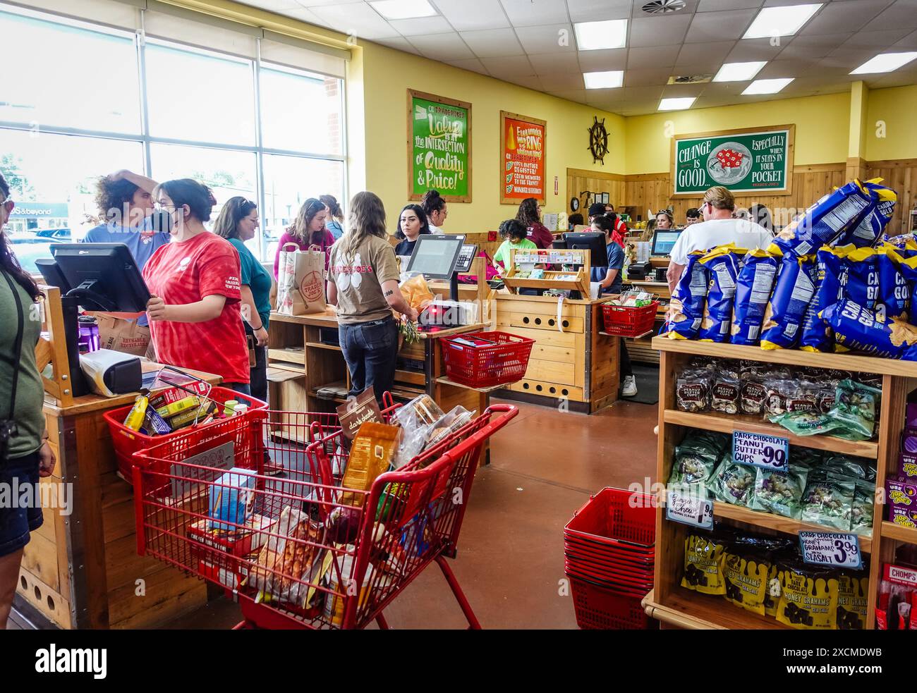 Crowded scene inside Trader Joe's supermarket with numerous people ...
