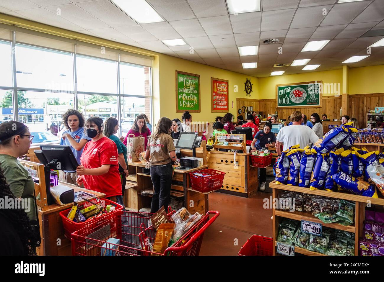 Crowded scene inside Trader Joe's supermarket with numerous people ...