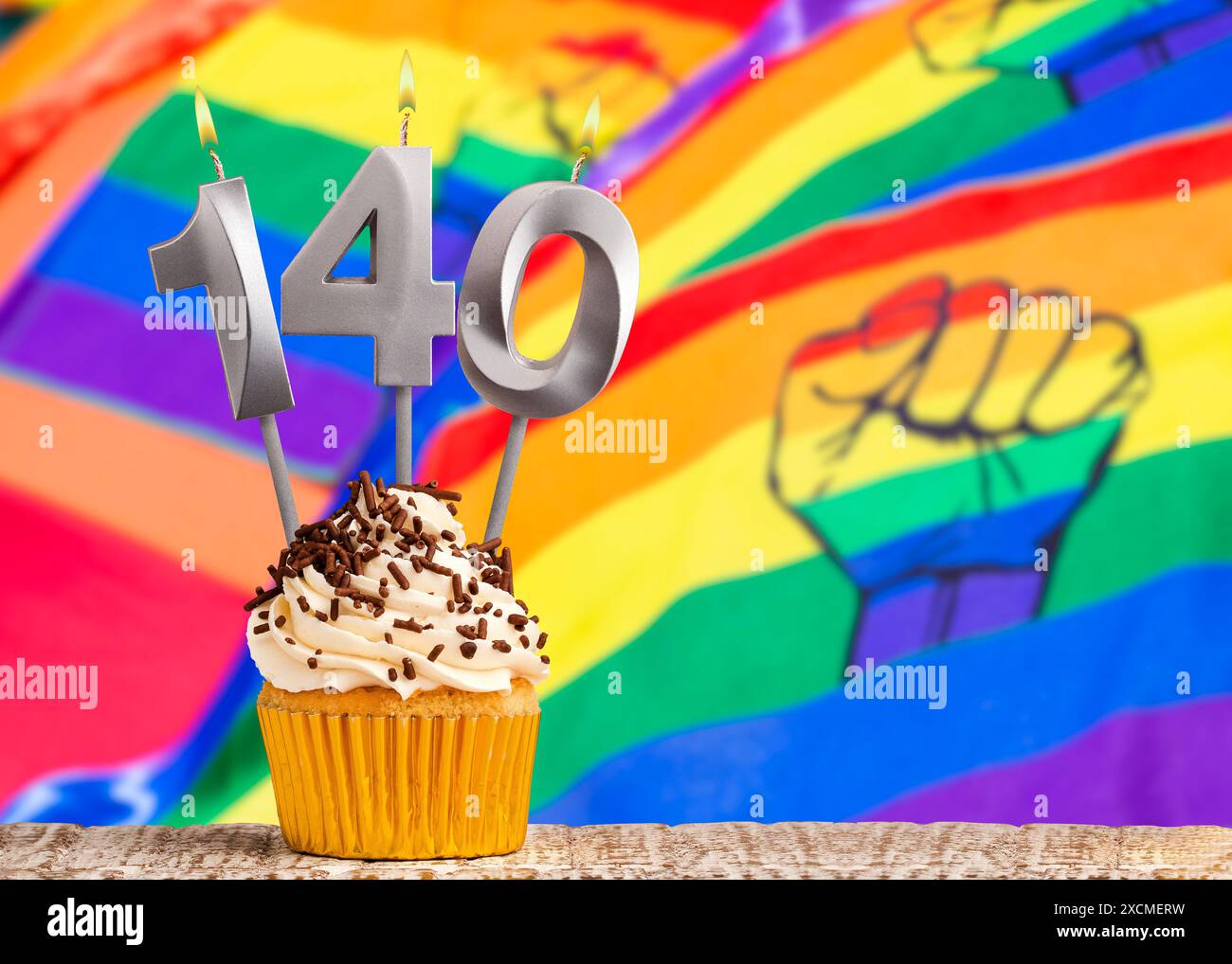 Birthday candle number 140 - Gay march flag background Stock Photo - Alamy