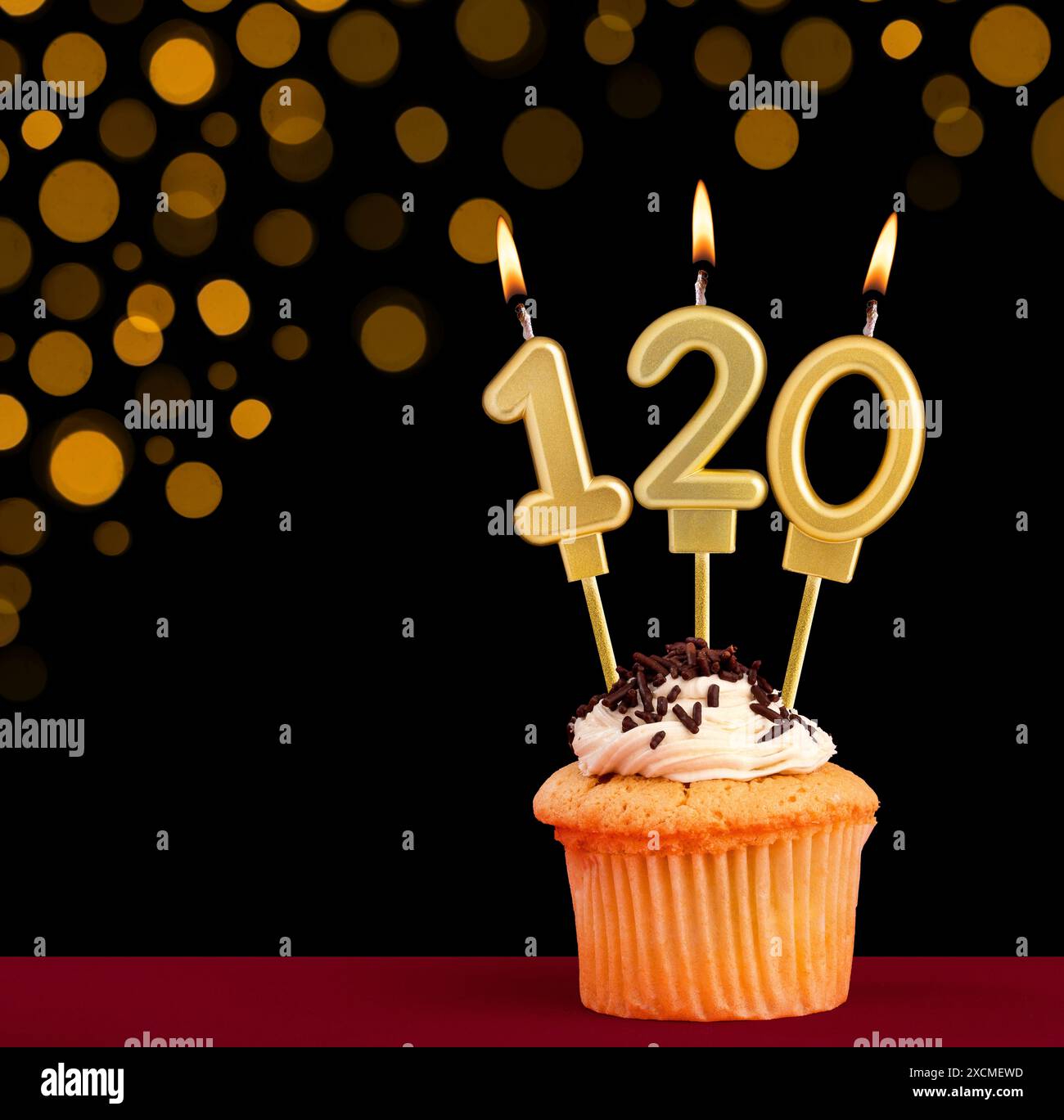 Birthday candle with cupcake - Number 120 on black background with out ...