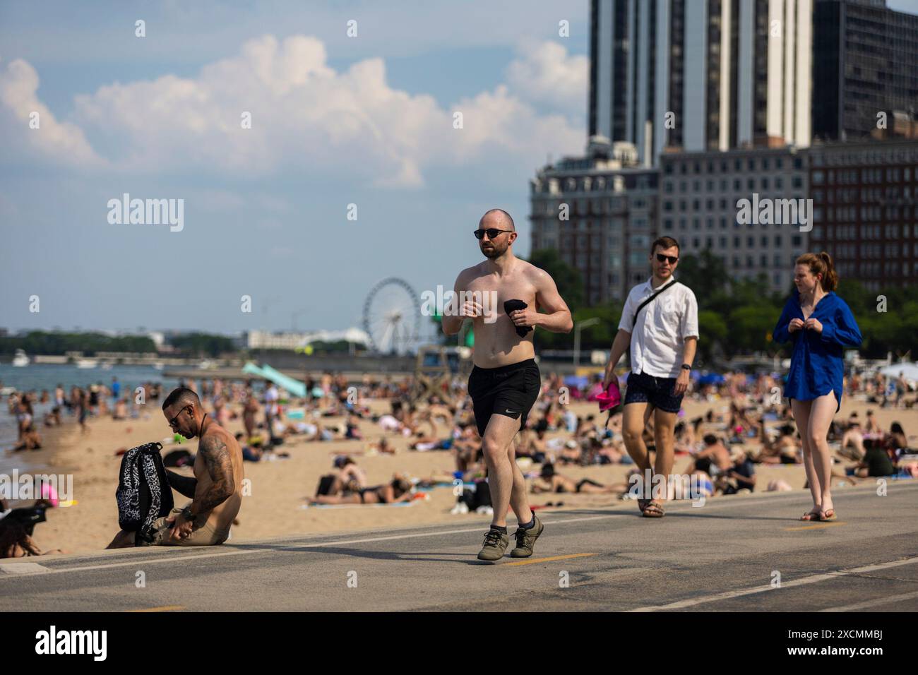 Chicago, USA. 17th June, 2024. People relax on a beach in Chicago, the ...