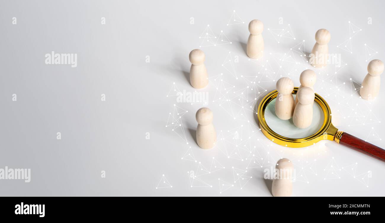 A wooden table with many wooden blocks with people icons on them ...