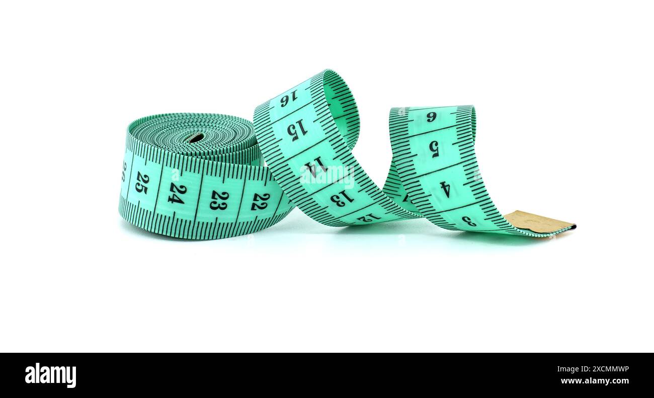 Spirals of green tape measure create a visual impression of motion ...