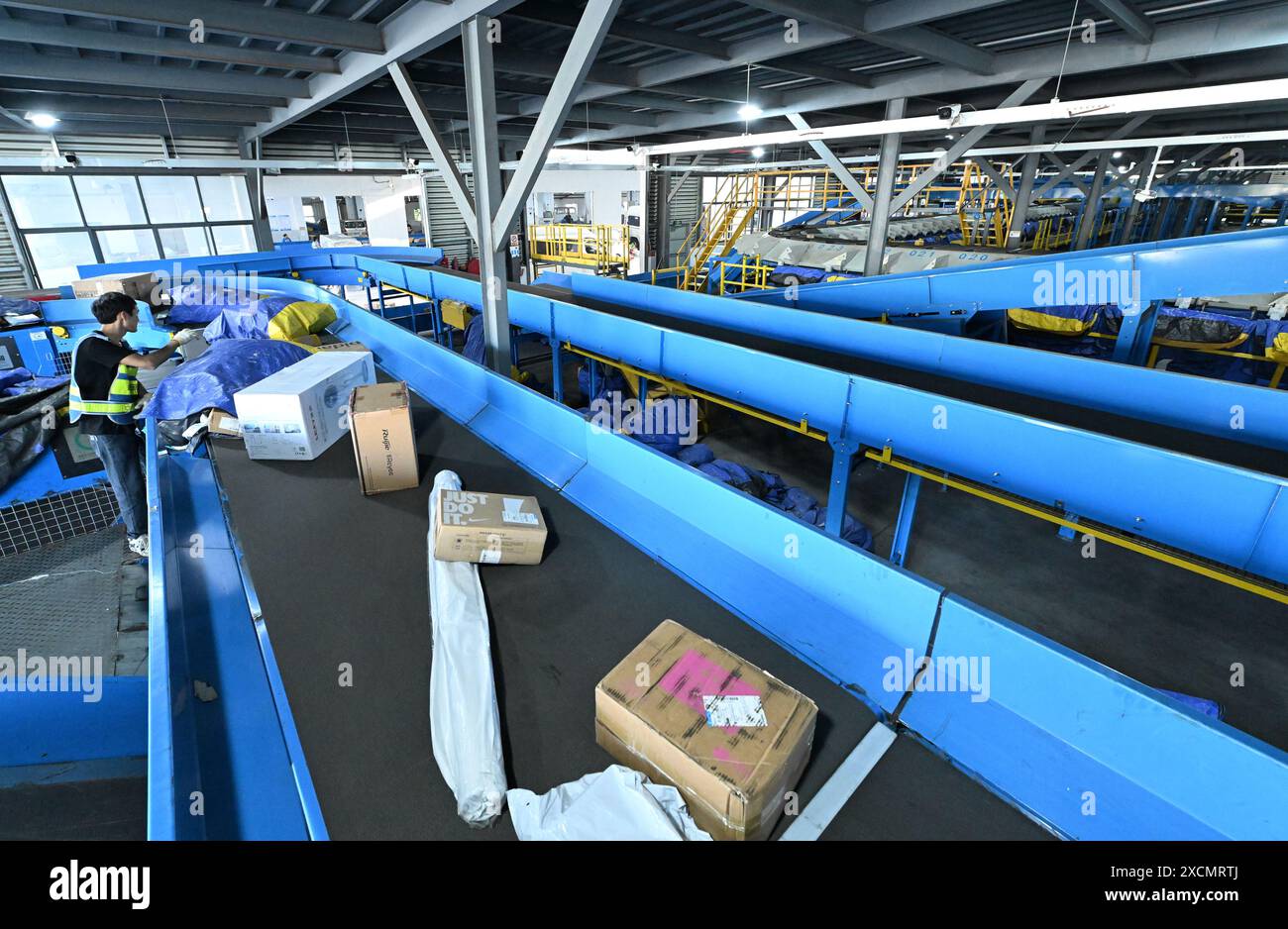 TAICANG, CHINA - JUNE 18, 2024 - An automated sorting line delivers express goods at an express ...