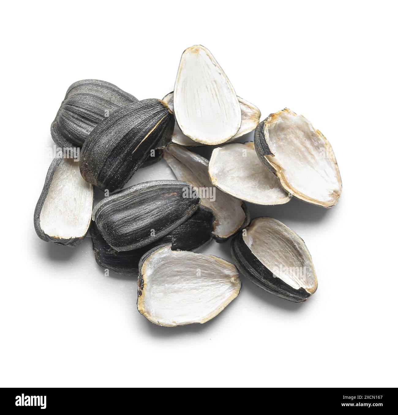 Sunflower seeds and shells on white background Stock Photo - Alamy