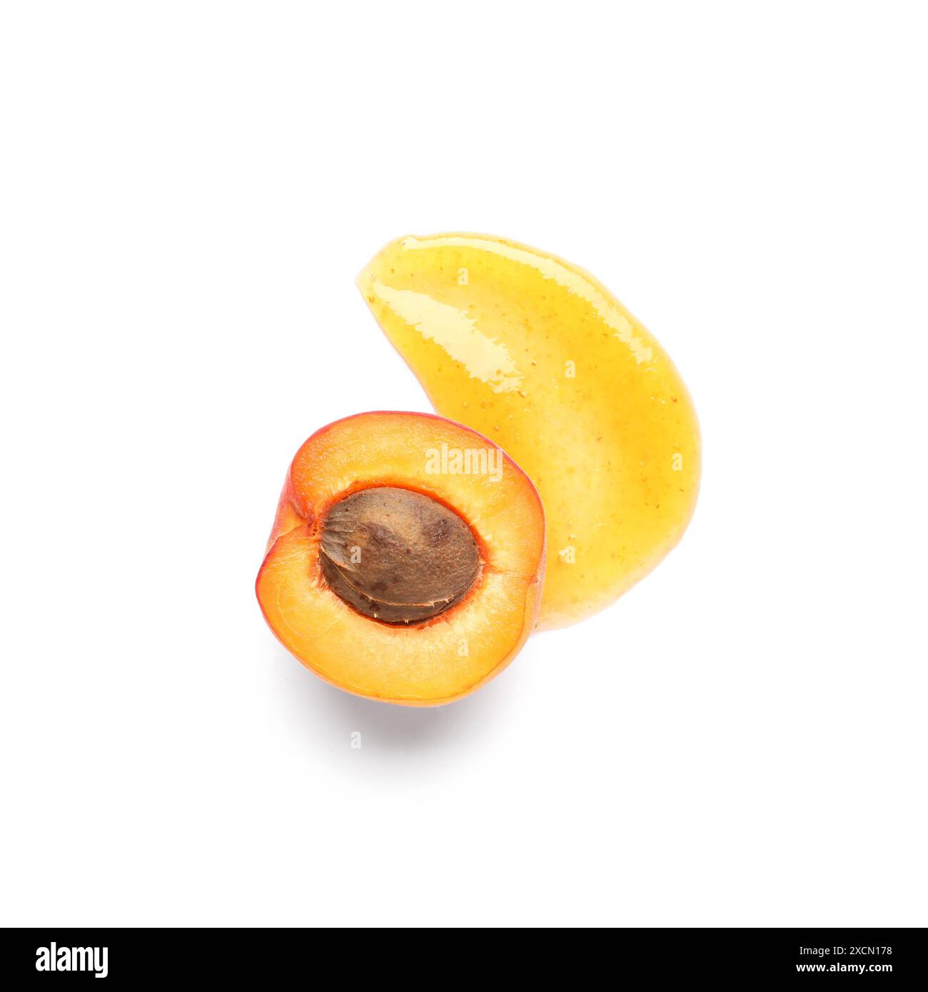 Sweet apricot and smear of jam on white background Stock Photo - Alamy