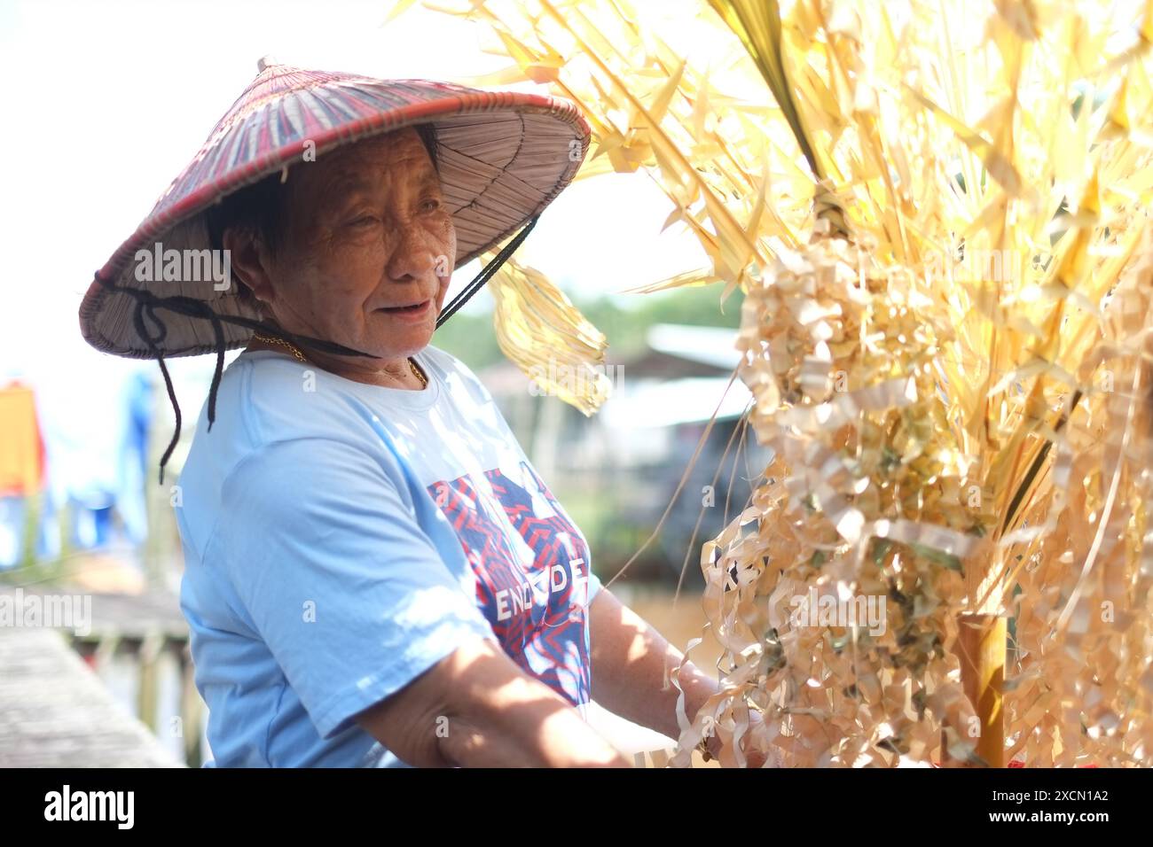 A men prepare traditional props for Melanau serahang ritual during Kaul ...