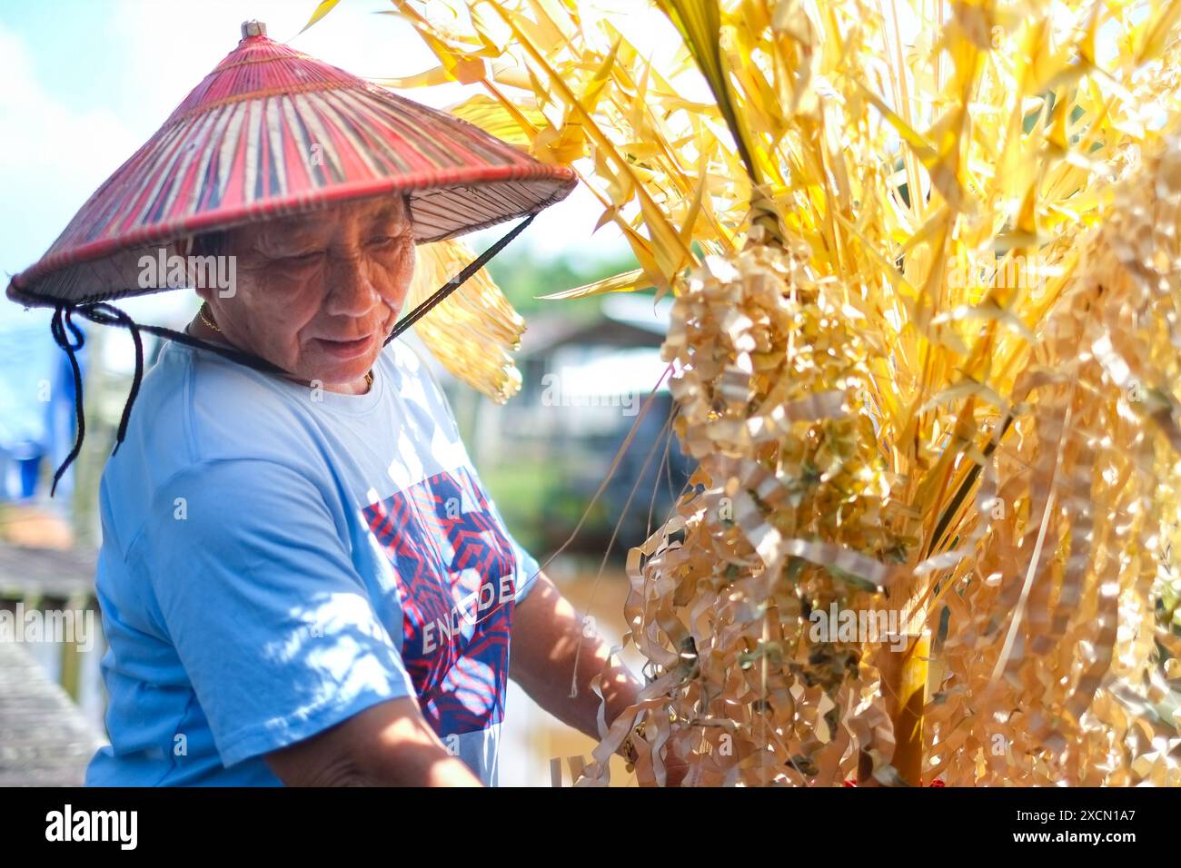 A men prepare traditional props for Melanau serahang ritual during Kaul ...