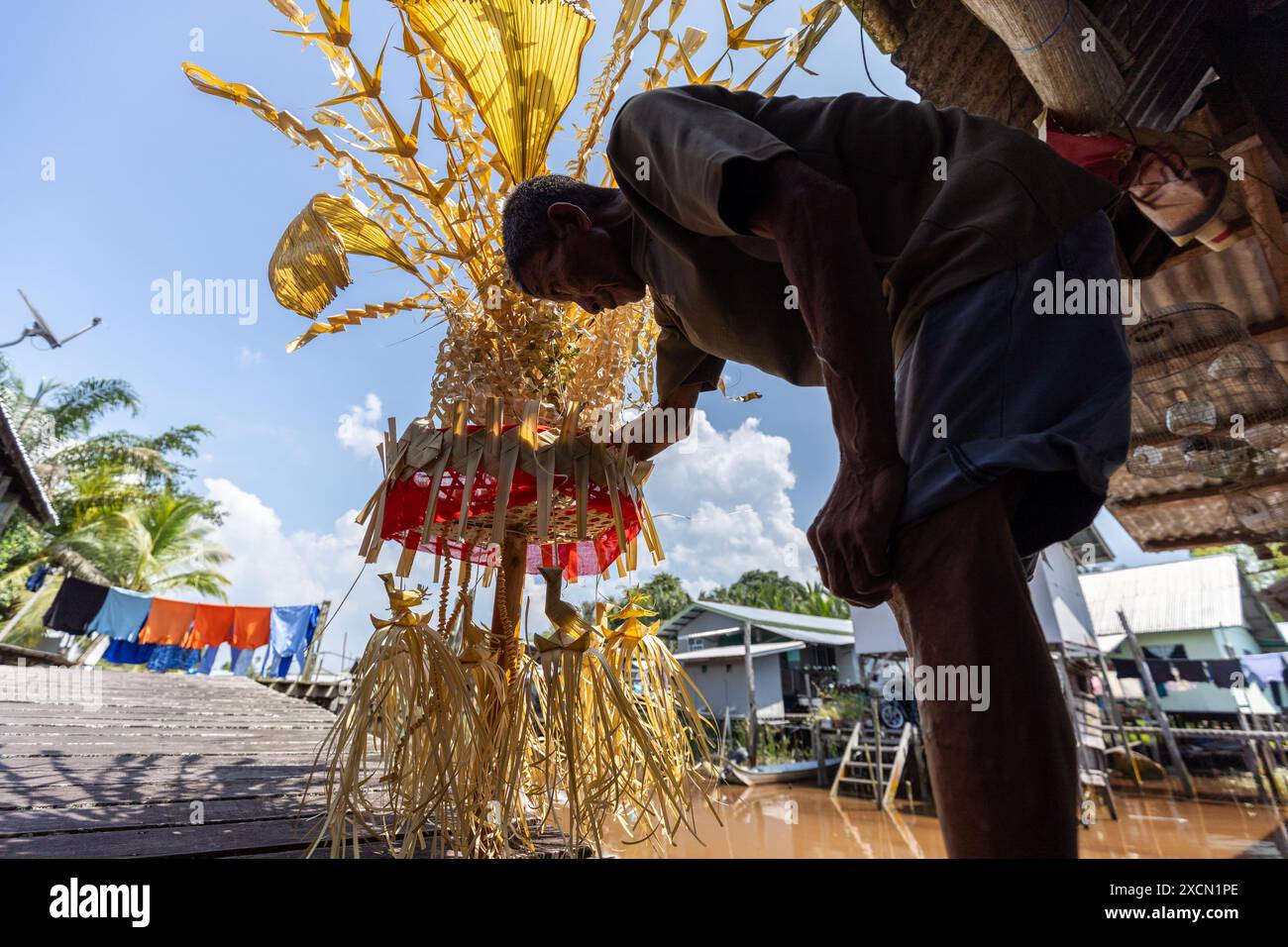 A men prepare traditional props for Melanau serahang ritual during Kaul ...