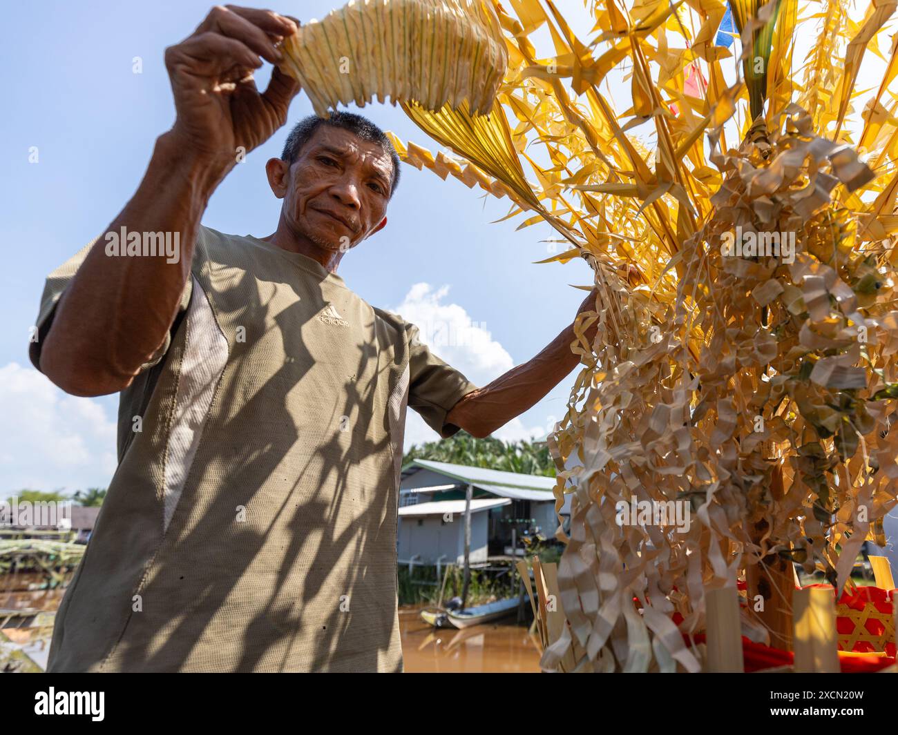 A men prepare traditional props for Melanau serahang ritual during Kaul ...