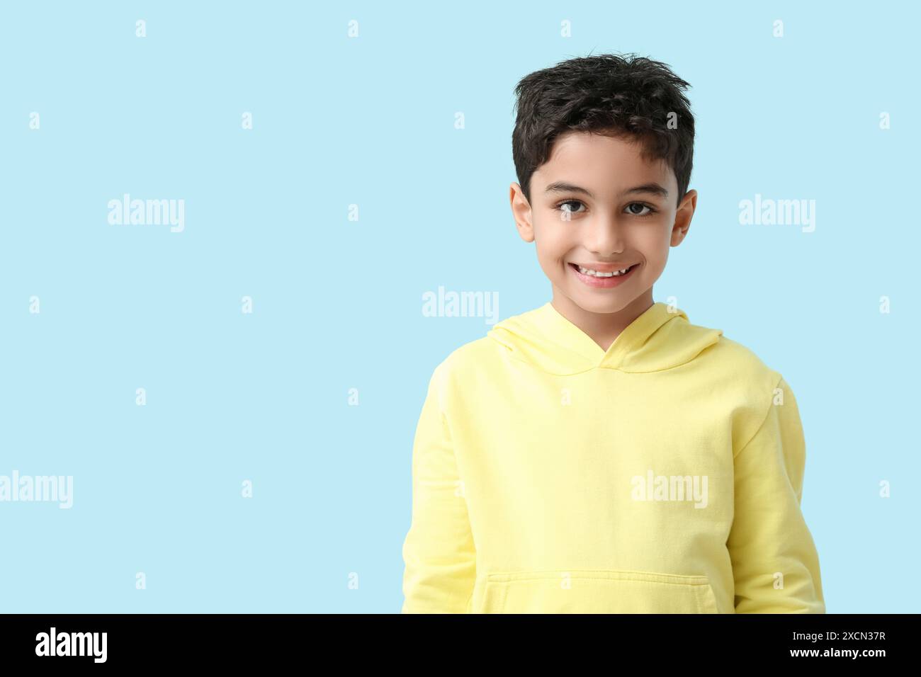 Cute little boy on blue background Stock Photo - Alamy