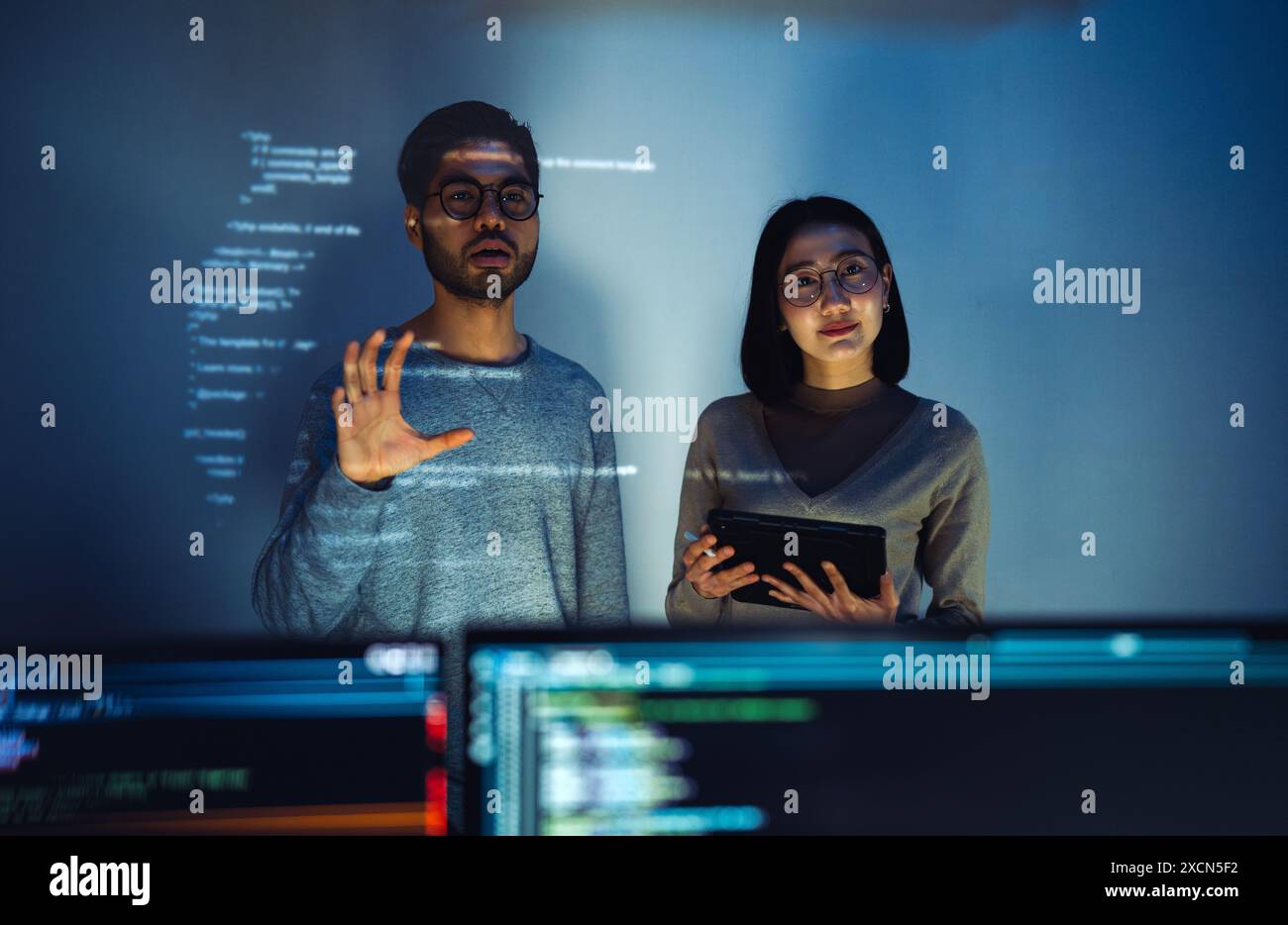 Asian programmer engaged in coding hi-res stock photography and images ...