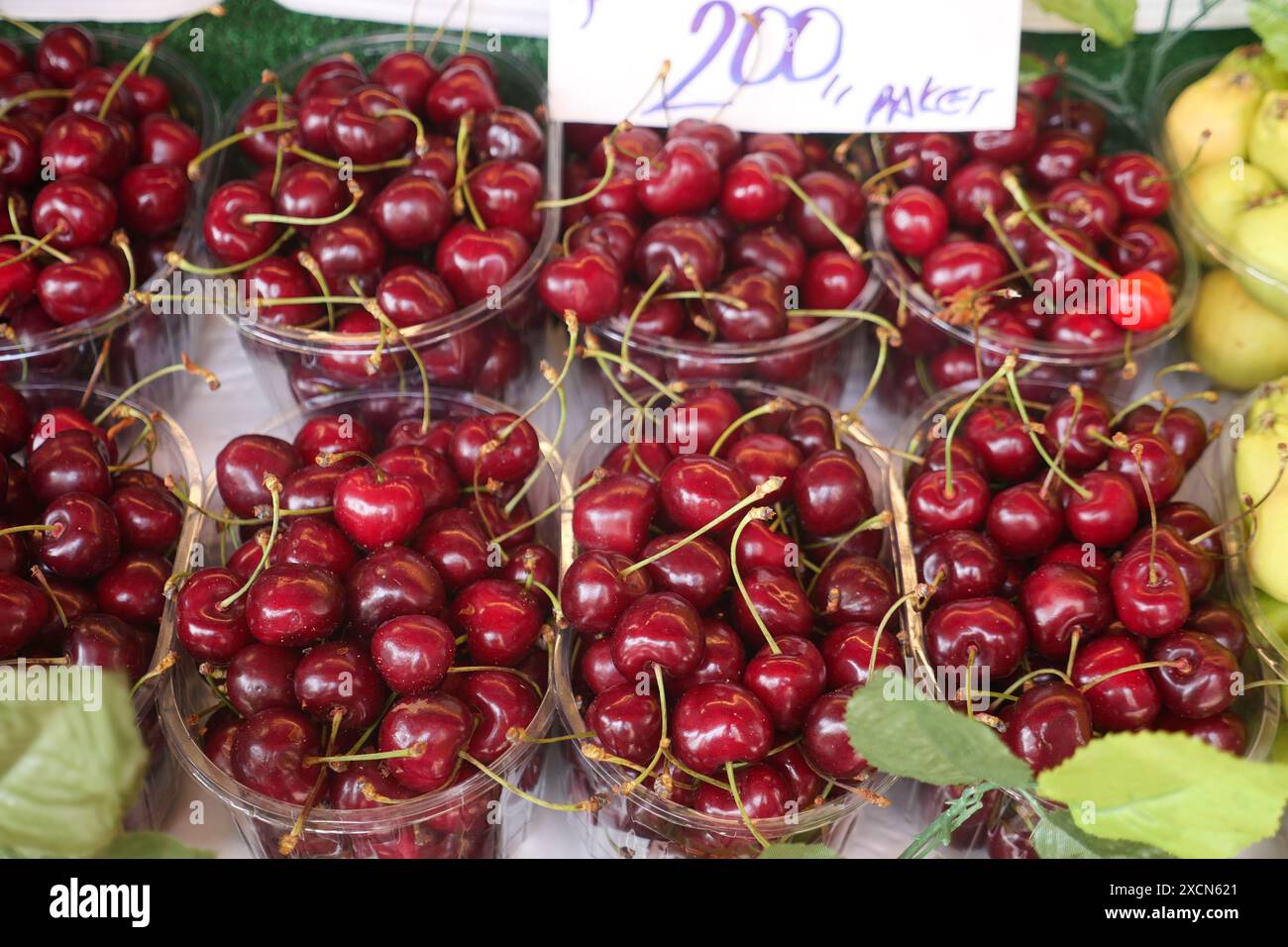 ripe fresh cherry in a plastic packet selling on super market Stock ...