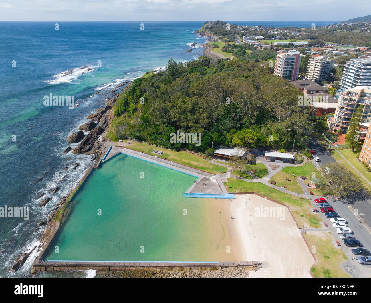 Aerail view over a tidal bathing pool off a sandy beach at Forster in ...