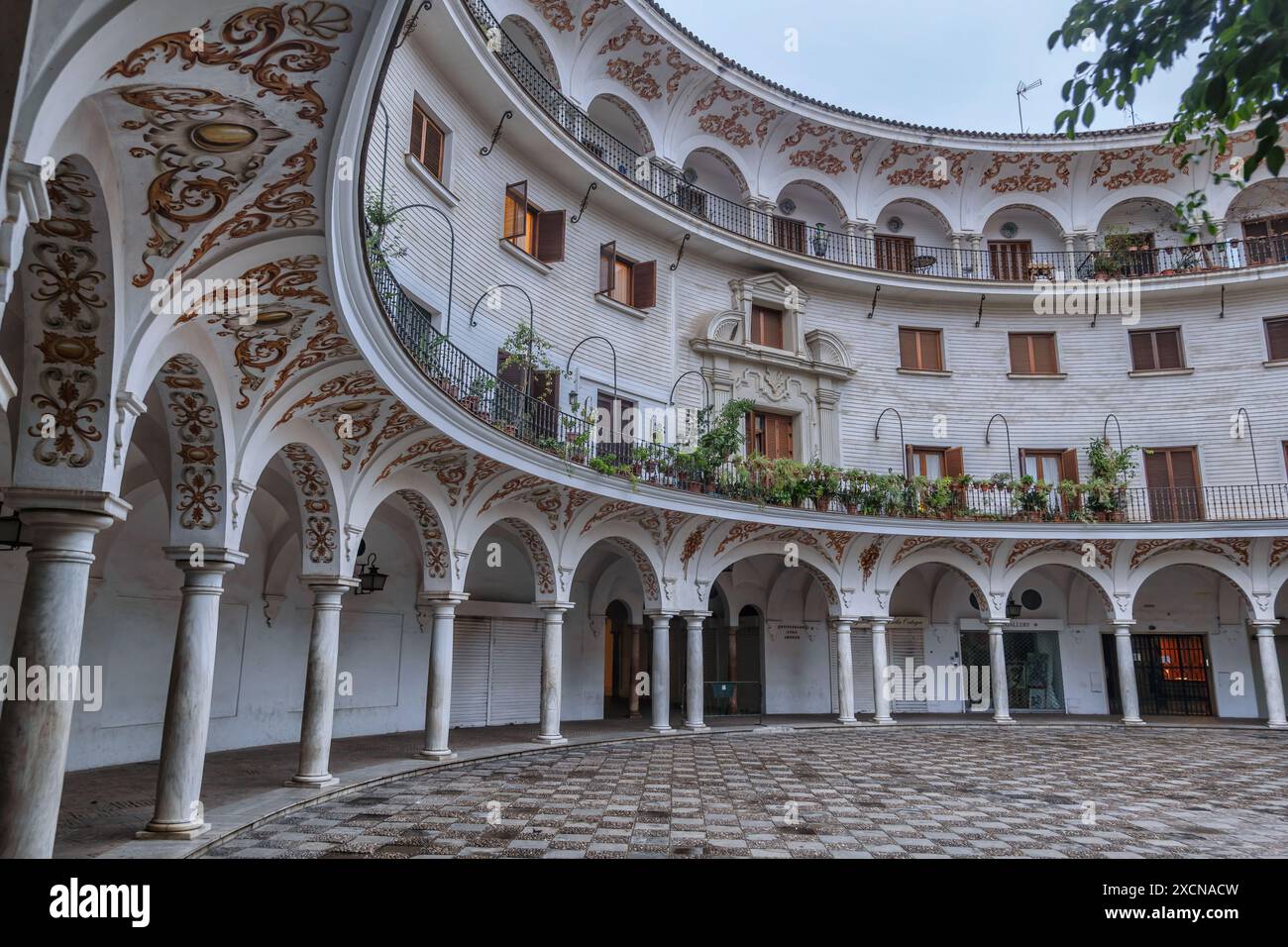 Plaza del Cabildo with curved colonnade in Seville, Andalusia, Spain ...