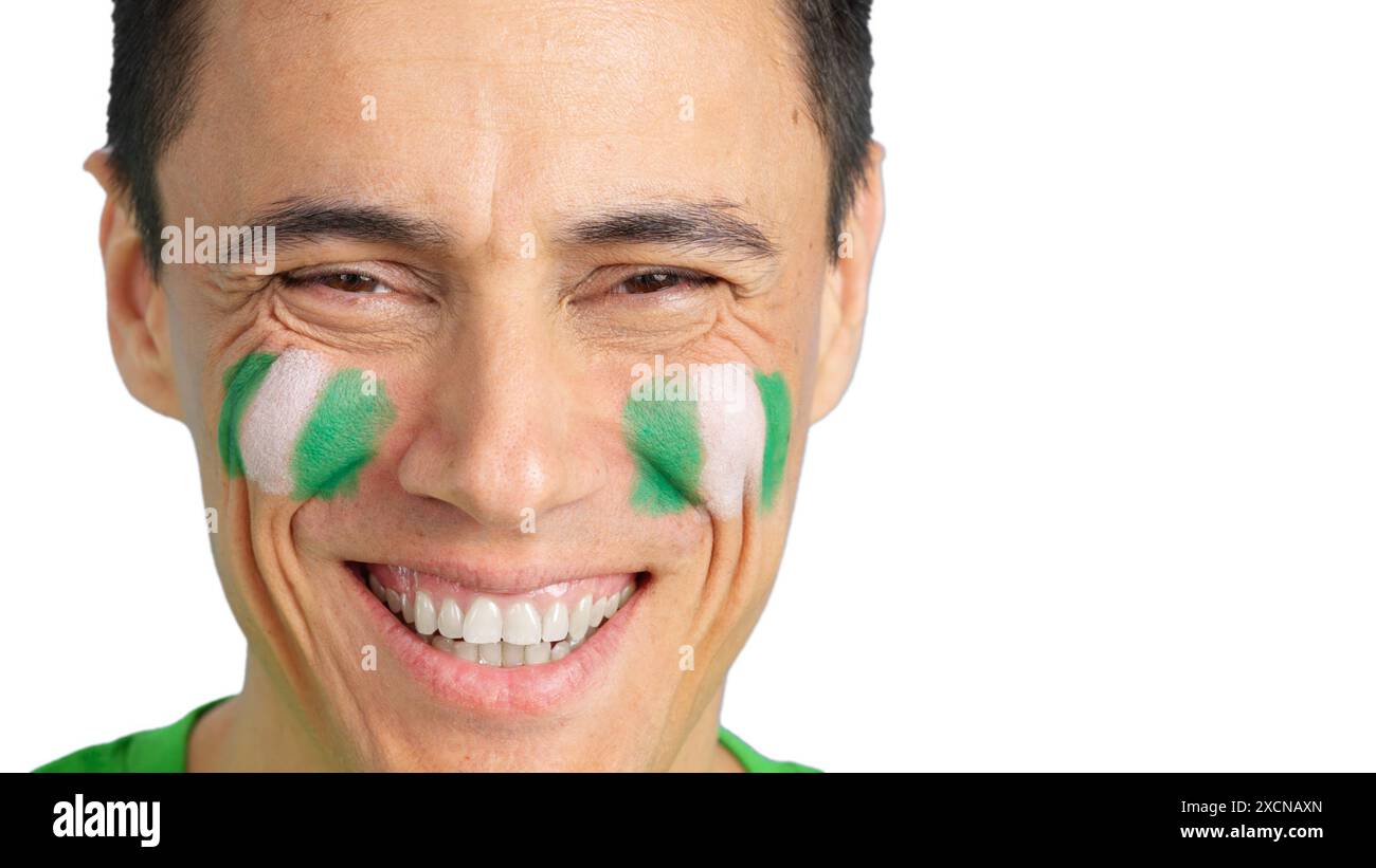 Man with a nigerian flag painted on the face smiling Stock Photo - Alamy