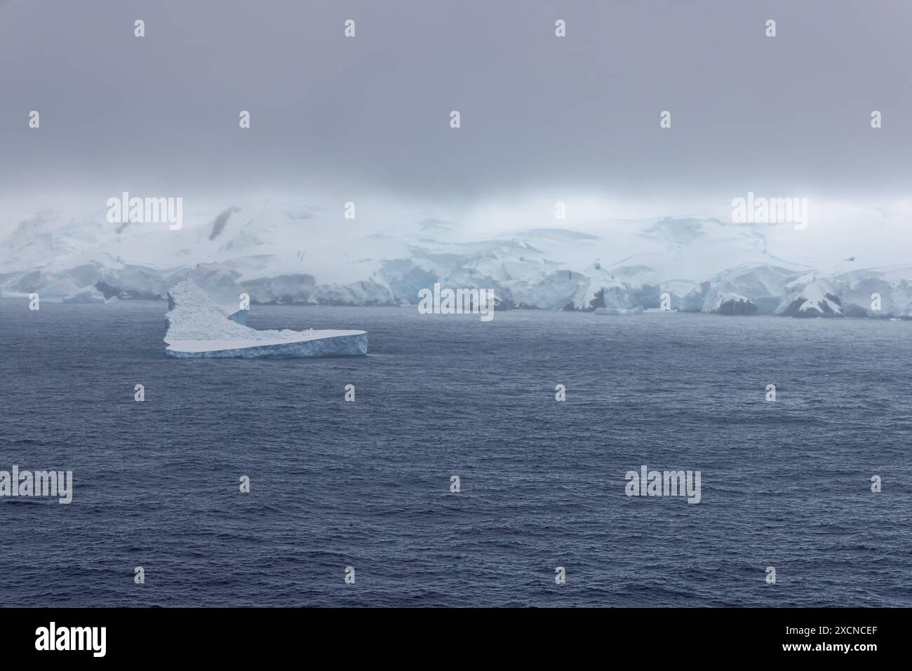 The icy coast of Anvers Island shrouded in a dense mist Stock Photo - Alamy