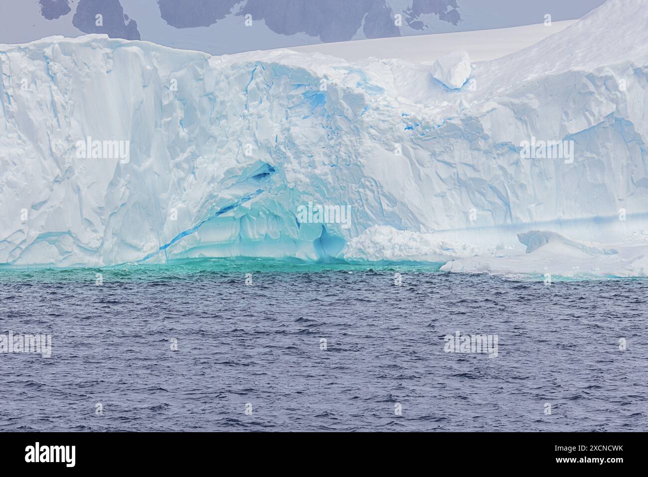 Intense colors from the blue ice in the core of an iceberg between ...