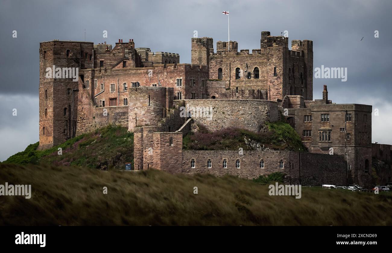 Bamburgh Castle located along the shoreline of the North Sea in ...