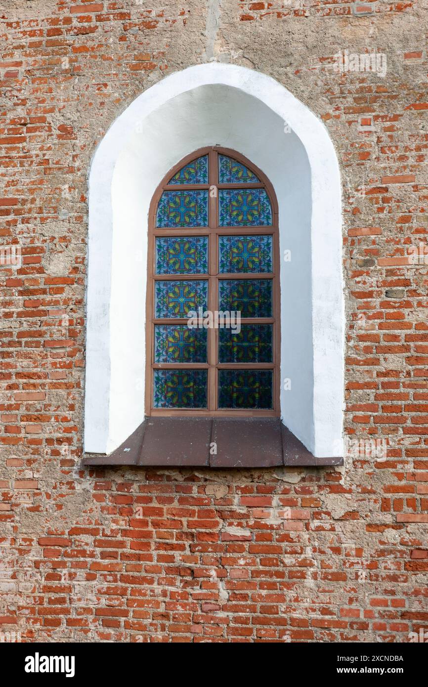 Arched window of an old church with stained glass Stock Photo - Alamy