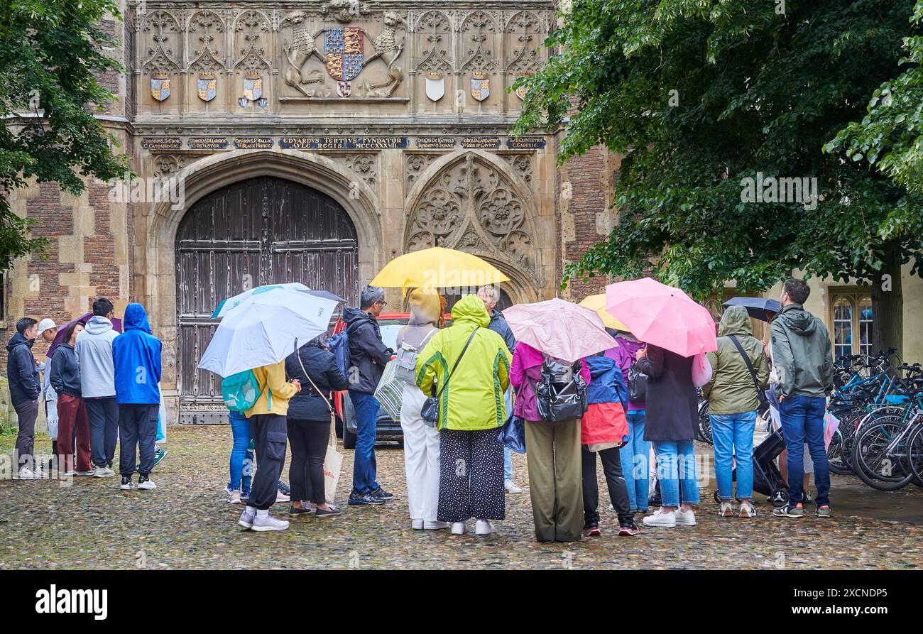 Chinese tourists with umbrellas outside the main entrance to Trinity ...