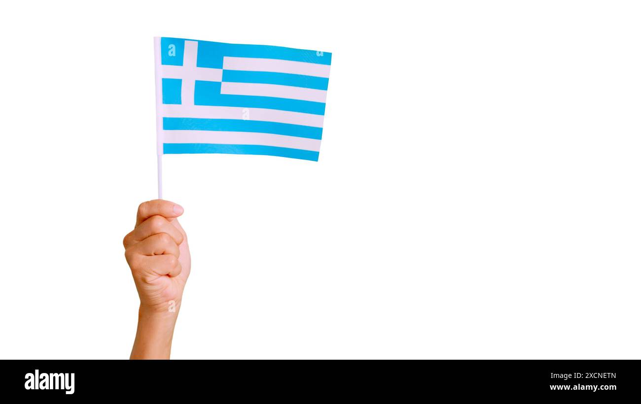 Wind waving a greek pennant holding by a hand Stock Photo - Alamy