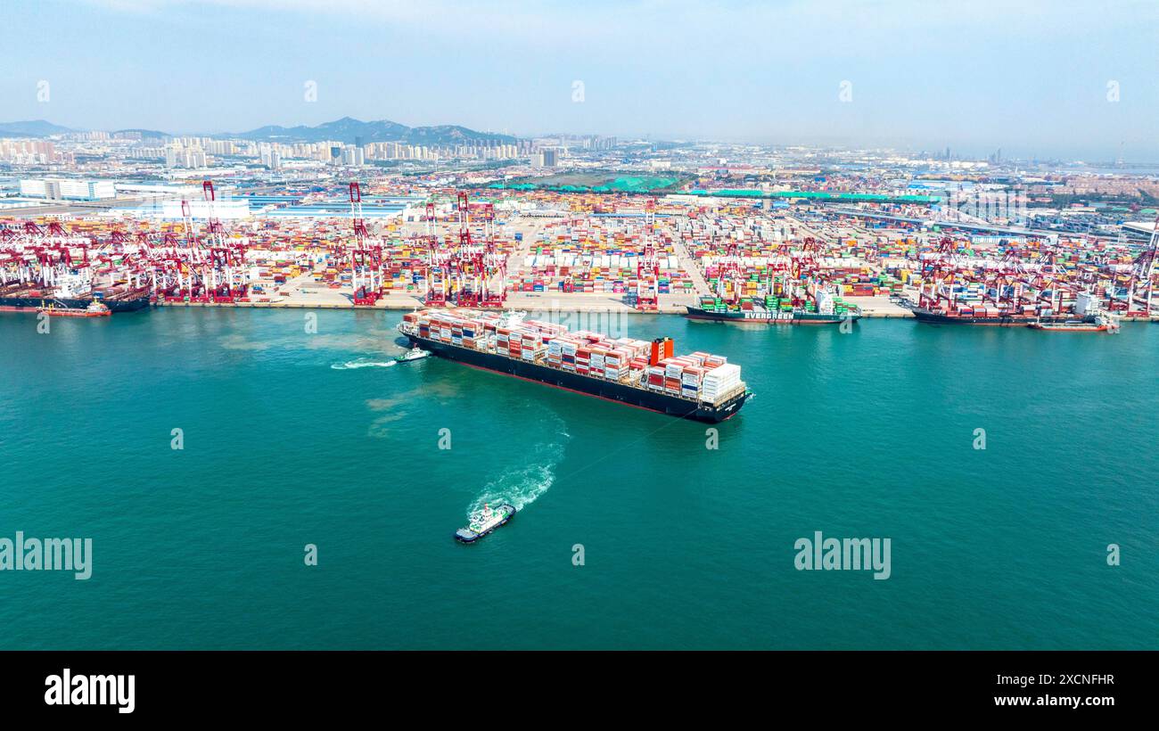 QINGDAO, CHINA - JUNE 18, 2024 - Container ships carry out container ...