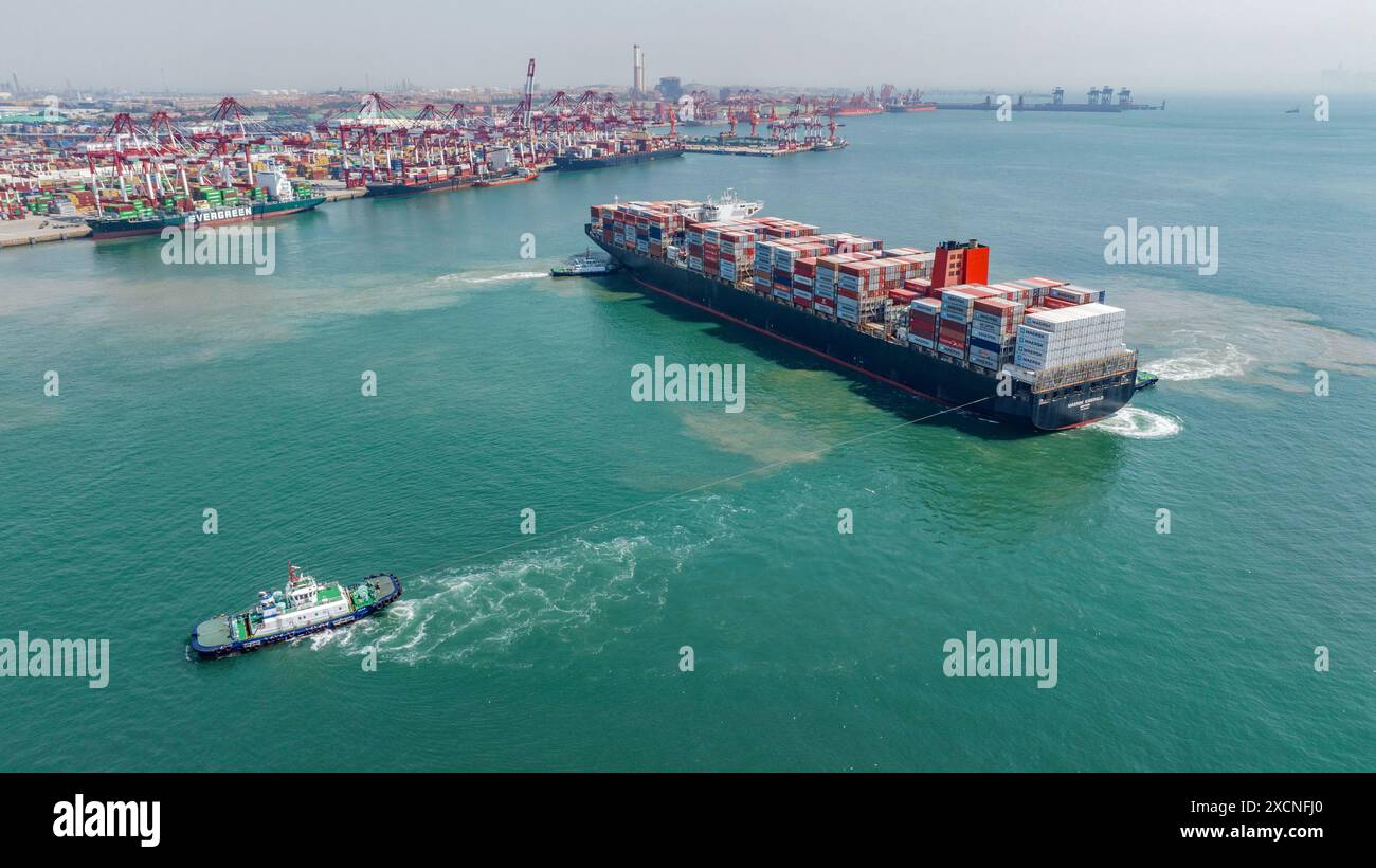 QINGDAO, CHINA - JUNE 18, 2024 - Container ships carry out container ...