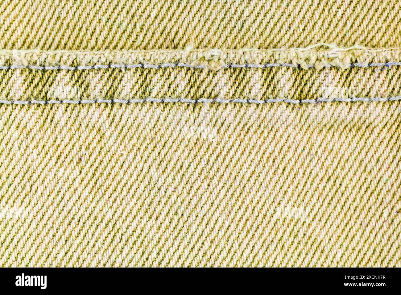 Yellow denim jeans pants cloth with seam, close up, macro. Fabric ...