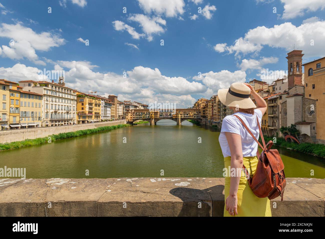 Young woman enjoys beautiful view on famous Old bridge in Florence ...