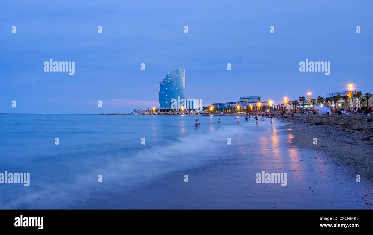 BARCELONA, SPAIN. August 18, 2024. A beach with a large hotel in the ...