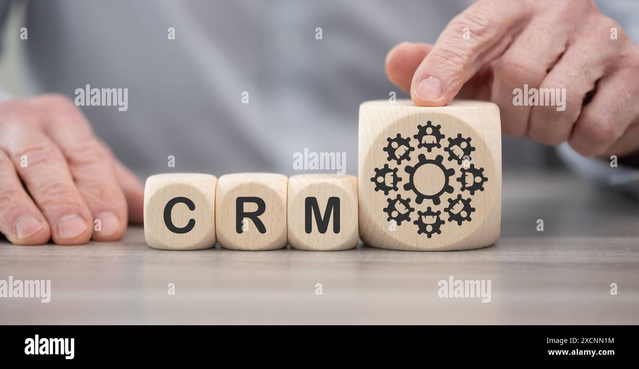Wooden blocks with symbol of crm concept Stock Photo - Alamy