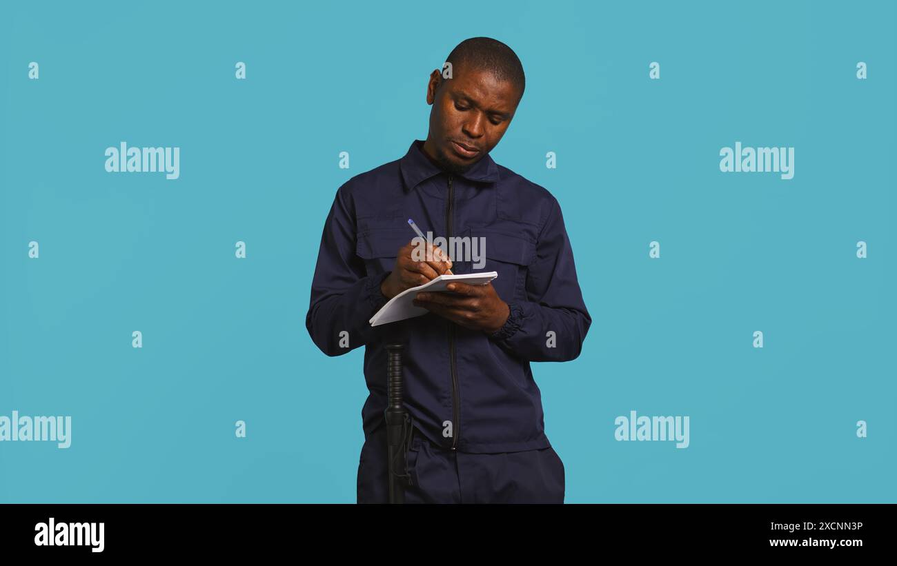 Security guard with notepad taking notes, receiving orders about ...