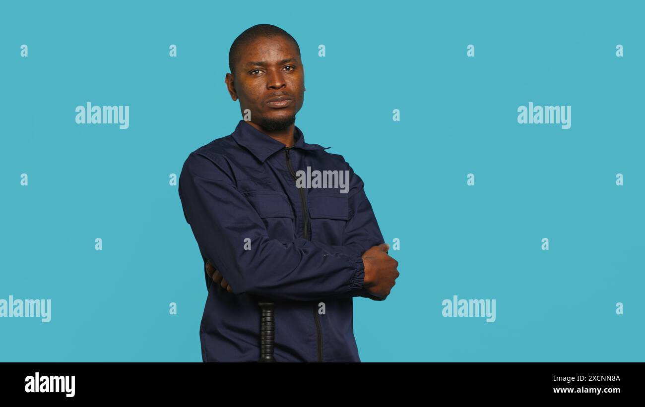 Security guard doing salute hand gesture, preparing to start job of ...
