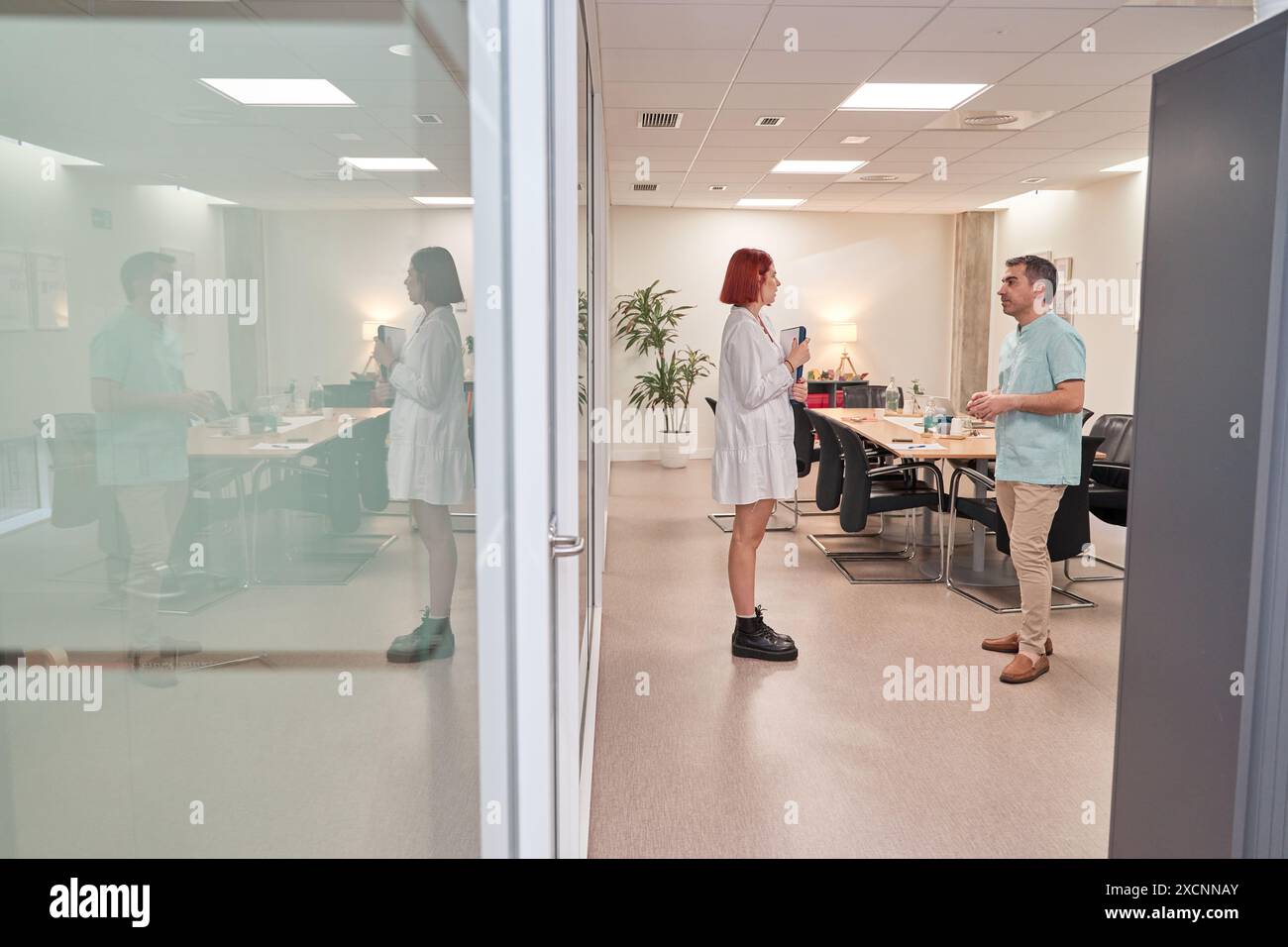 business couple talking in a modern office Stock Photo - Alamy