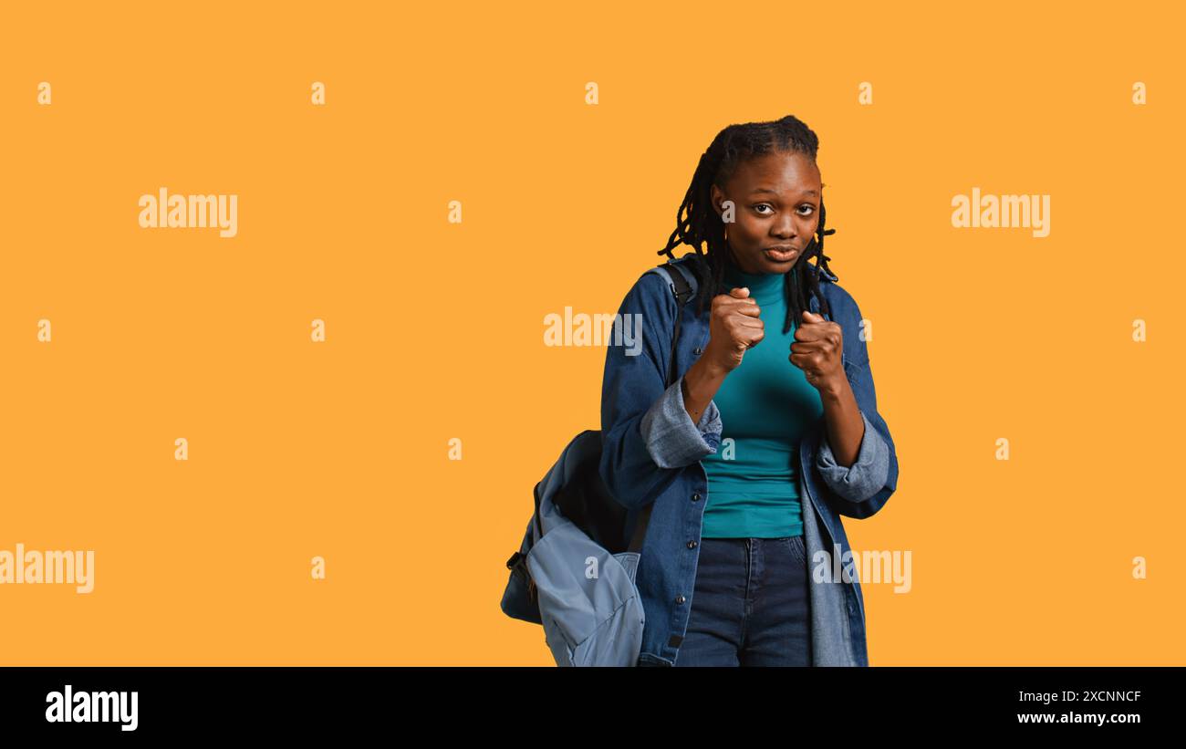 African american woman jokingly pretending to fight, having friendly ...