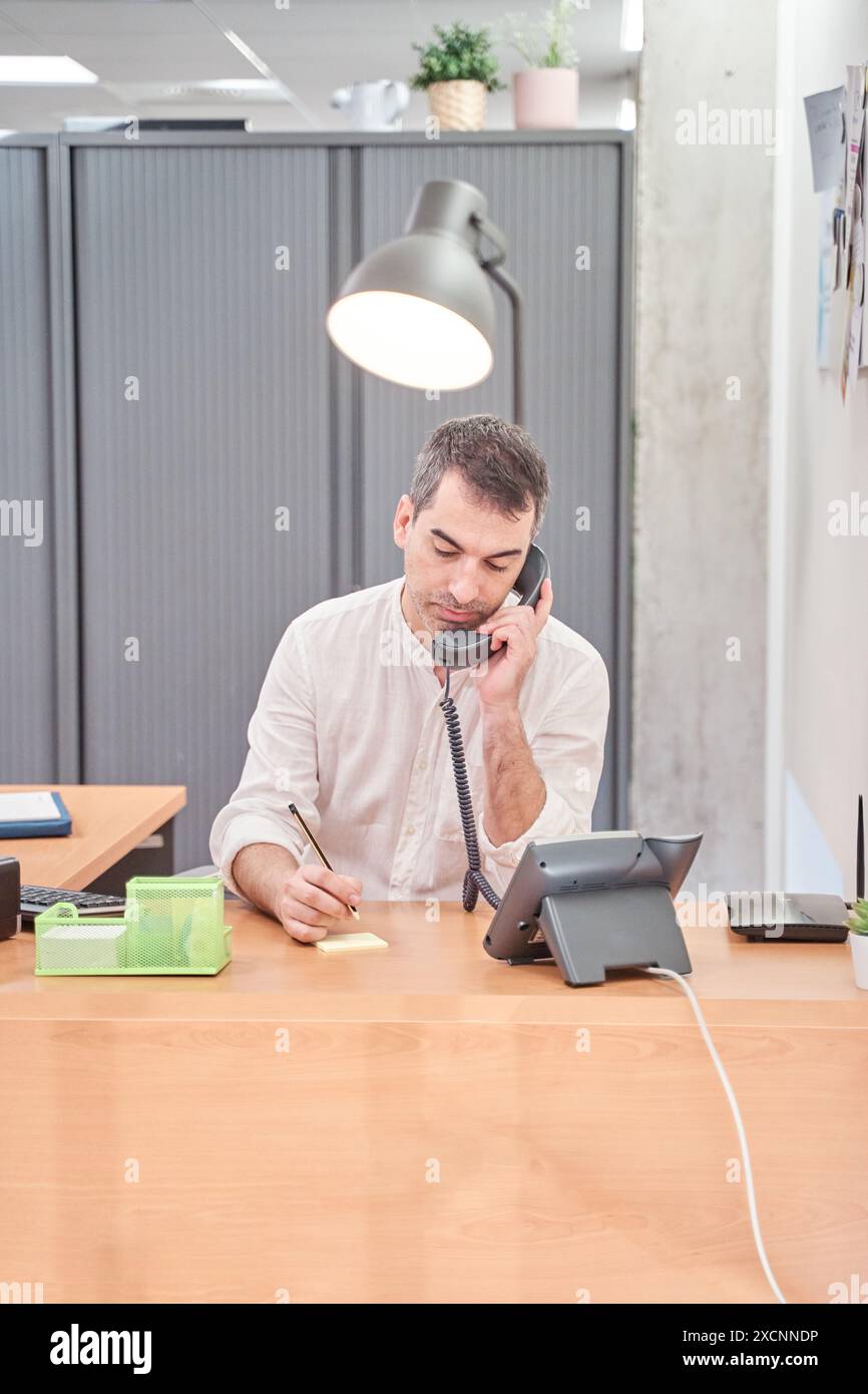 Employee using landline phone call hi-res stock photography and images ...