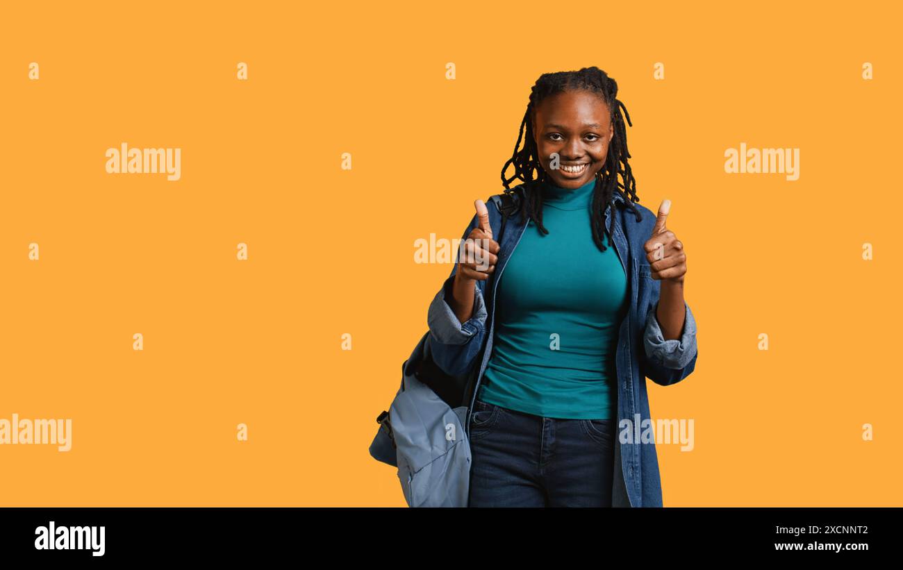 Happy girl doing thumbs up hand gesturing, showing approval, having ...