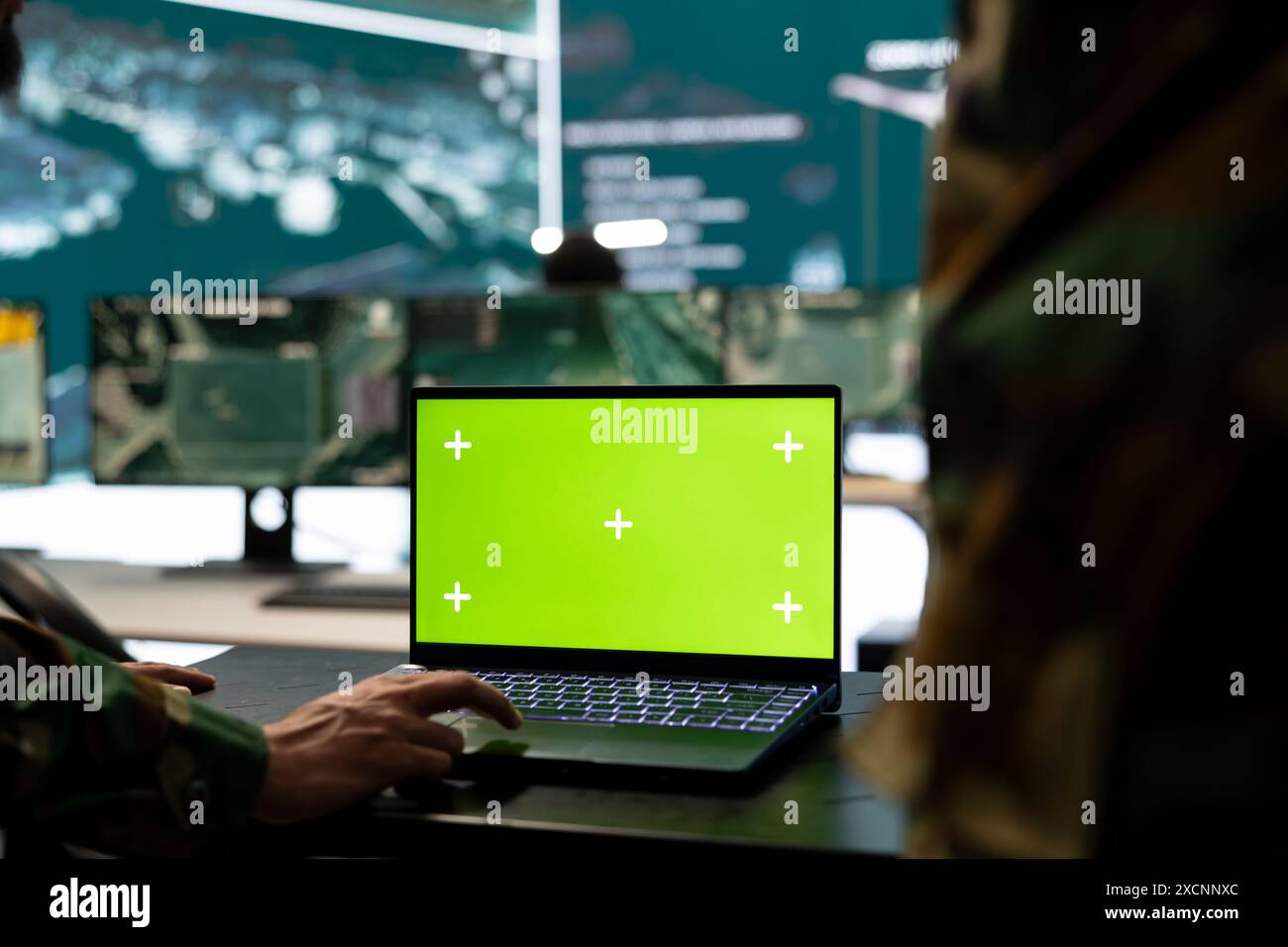 Trooper monitors chroma key mockup display on a laptop in general ...