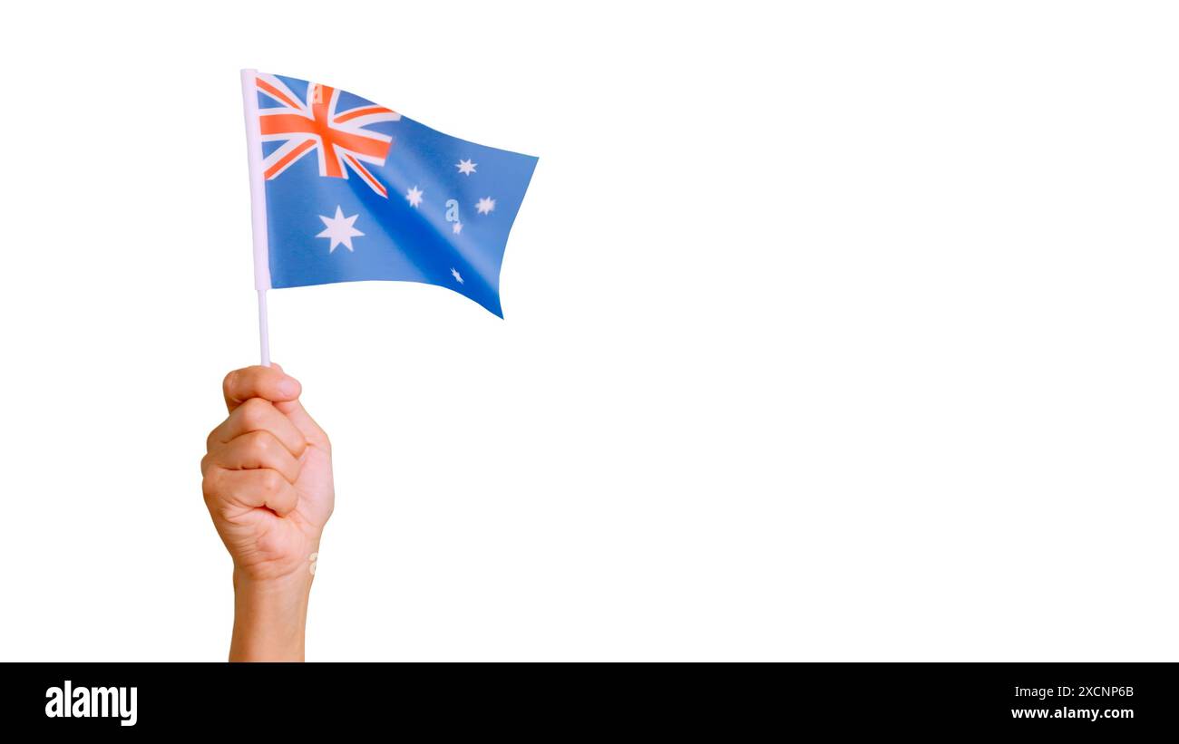 Wind waving a australian pennant holding by a person Stock Photo - Alamy