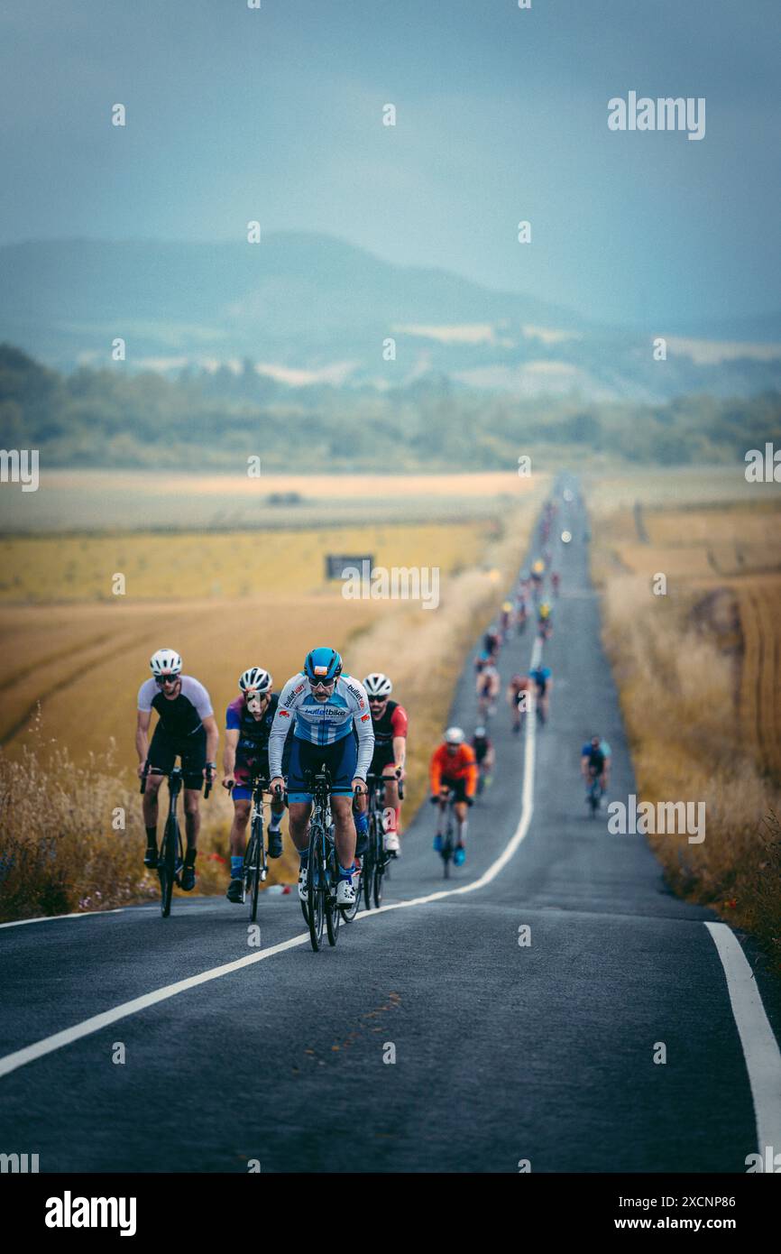Triathletes on bikes in a triathlon without drafting hi-res stock ...