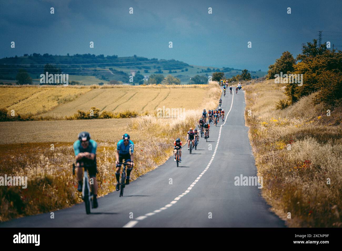 Triathletes on bikes in a triathlon without drafting hi-res stock ...