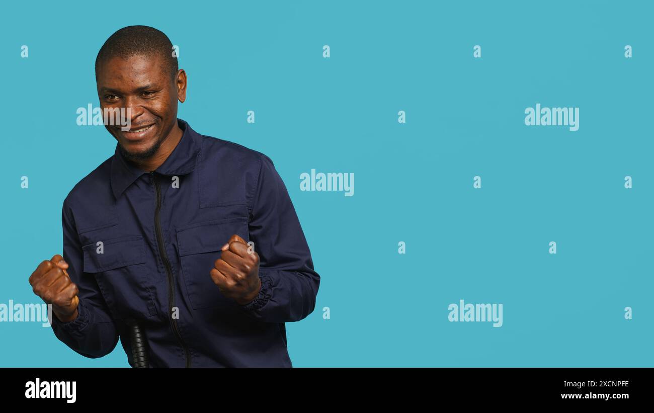 Portrait of security guard looking around while overseeing premises ...